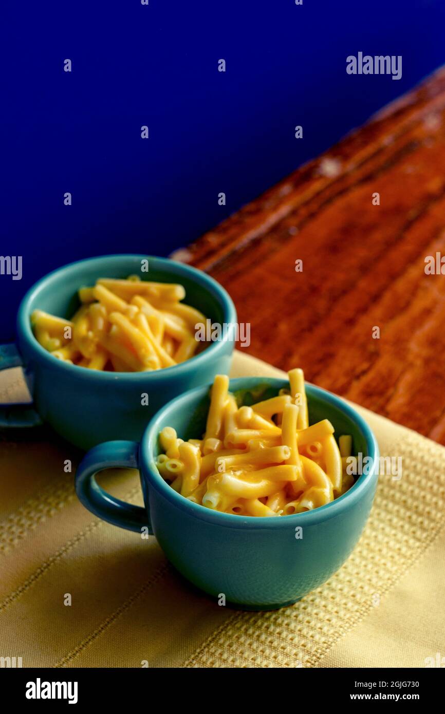 Stylized vintage retro macaroni and cheese served in small tea cups on ...