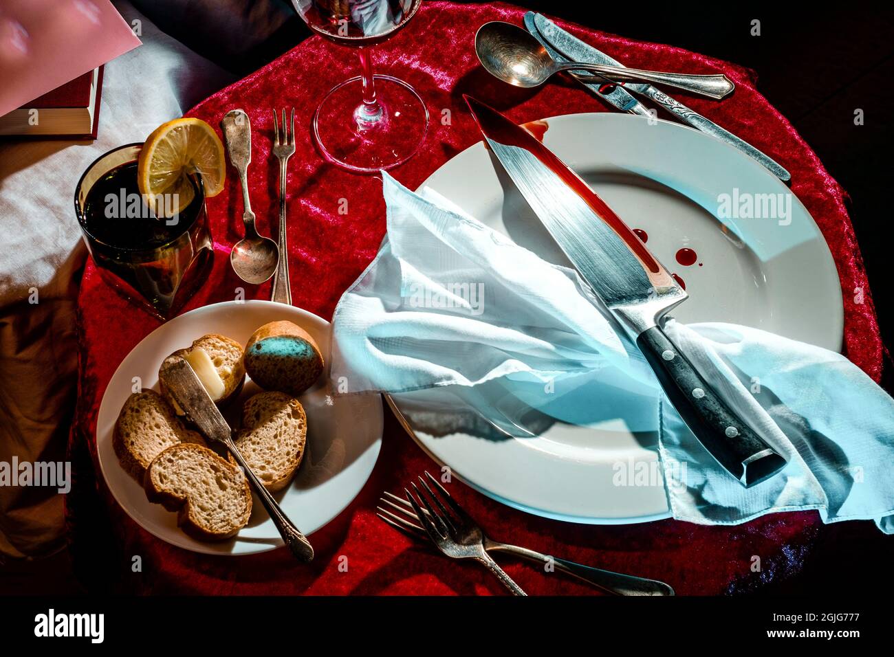 Macabre murder mystery dinner party event with bloody knife Stock Photo ...