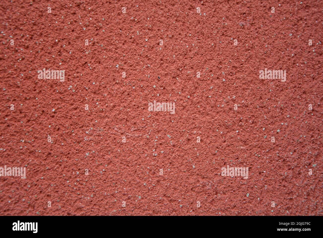 Garnet coloured granulated wall background Stock Photo - Alamy