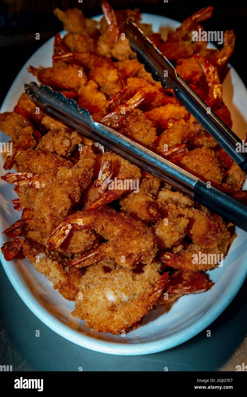 Large pile of popcorn shrimp tempura in buffet platter Stock Photo - Alamy