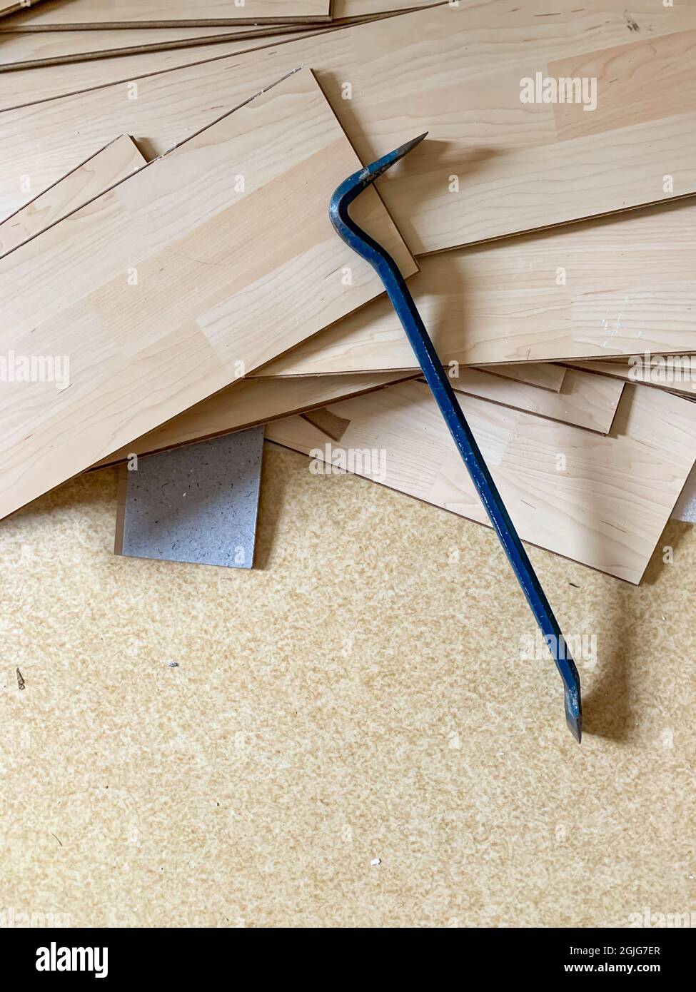 A crowbar and a pile of broken planks Stock Photo - Alamy