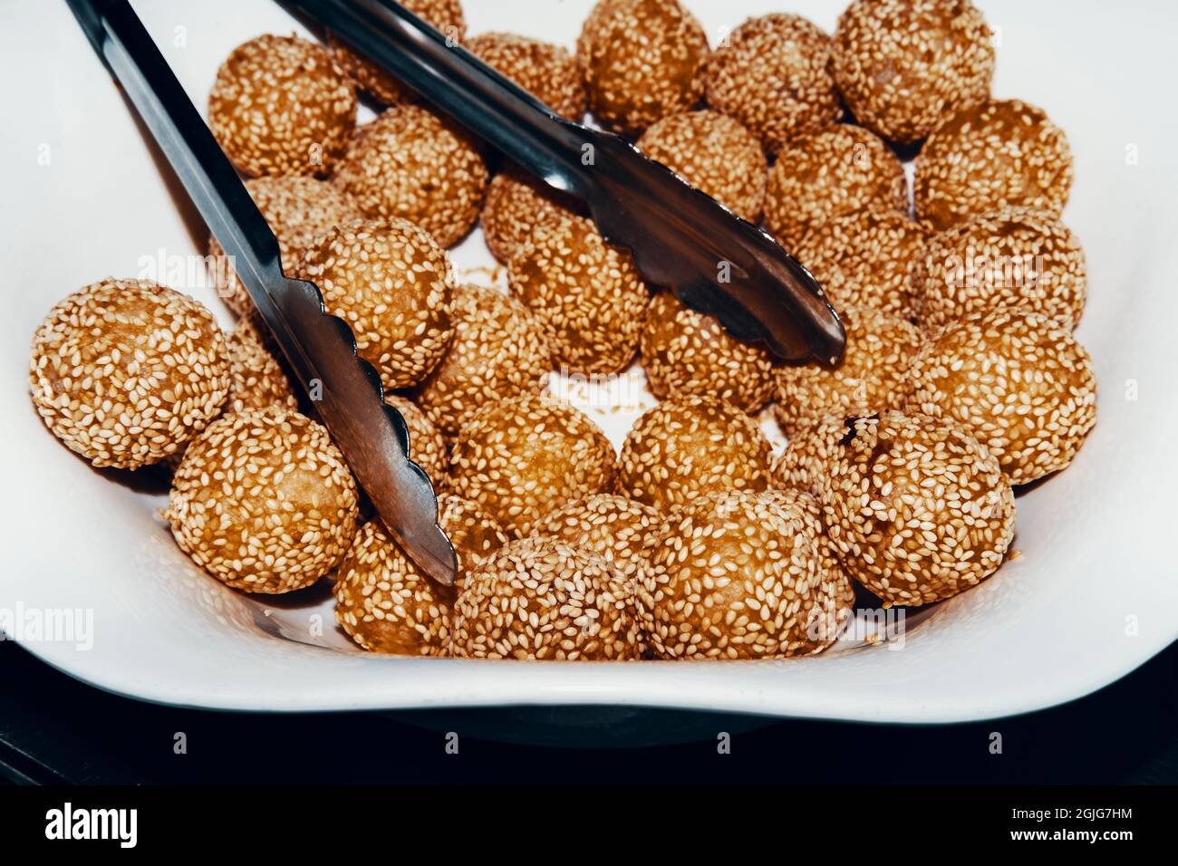 Chinese dessert sesame donuts in self serve buffet platter Stock Photo ...