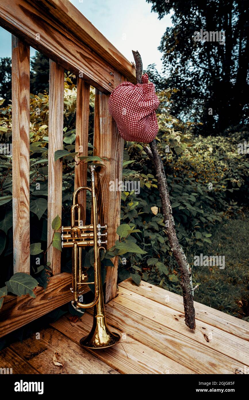 Traveling musicians trumpet and handkerchief picnic sack on a stick ...
