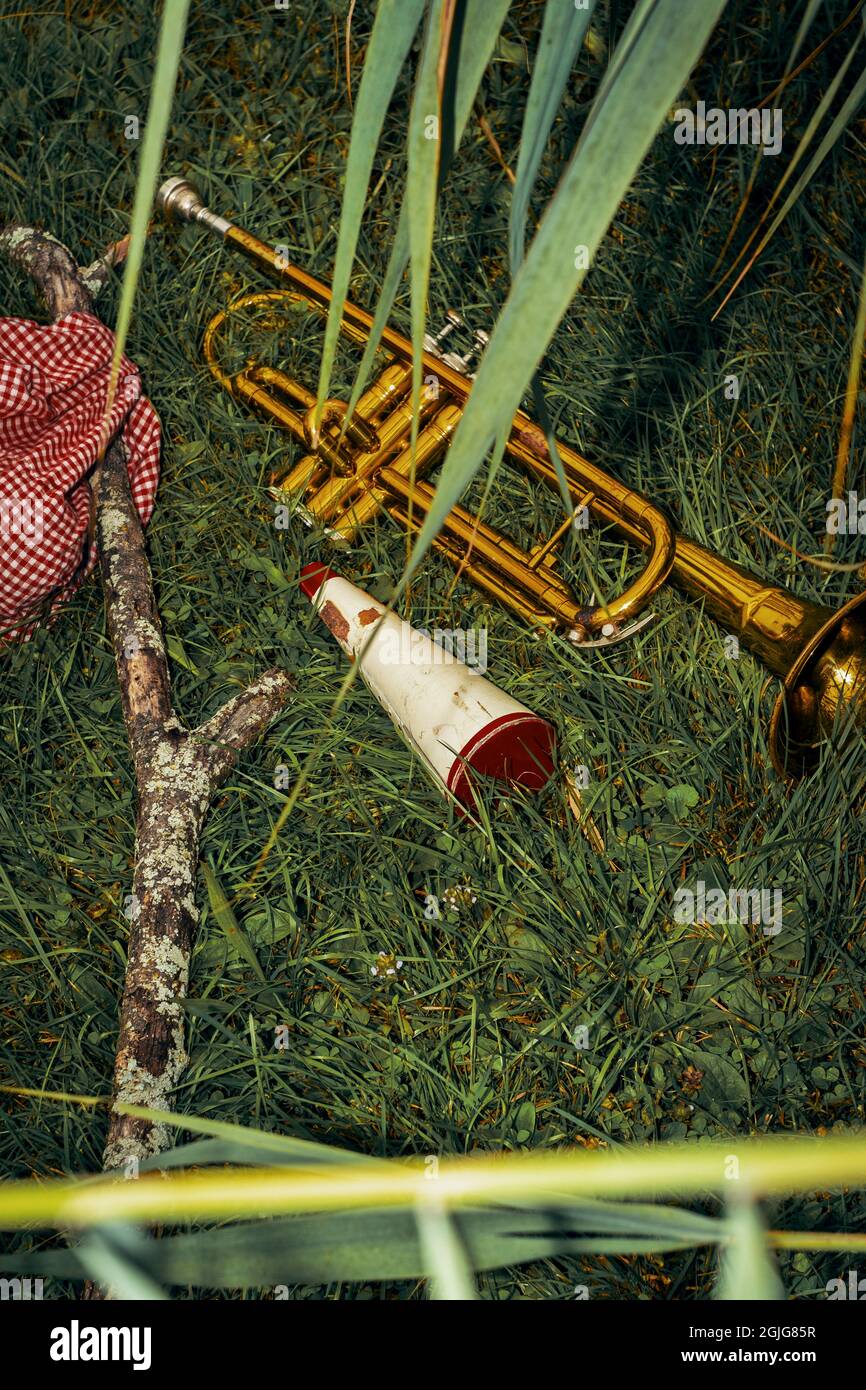 Traveling musicians trumpet and handkerchief picnic sack on a stick ...