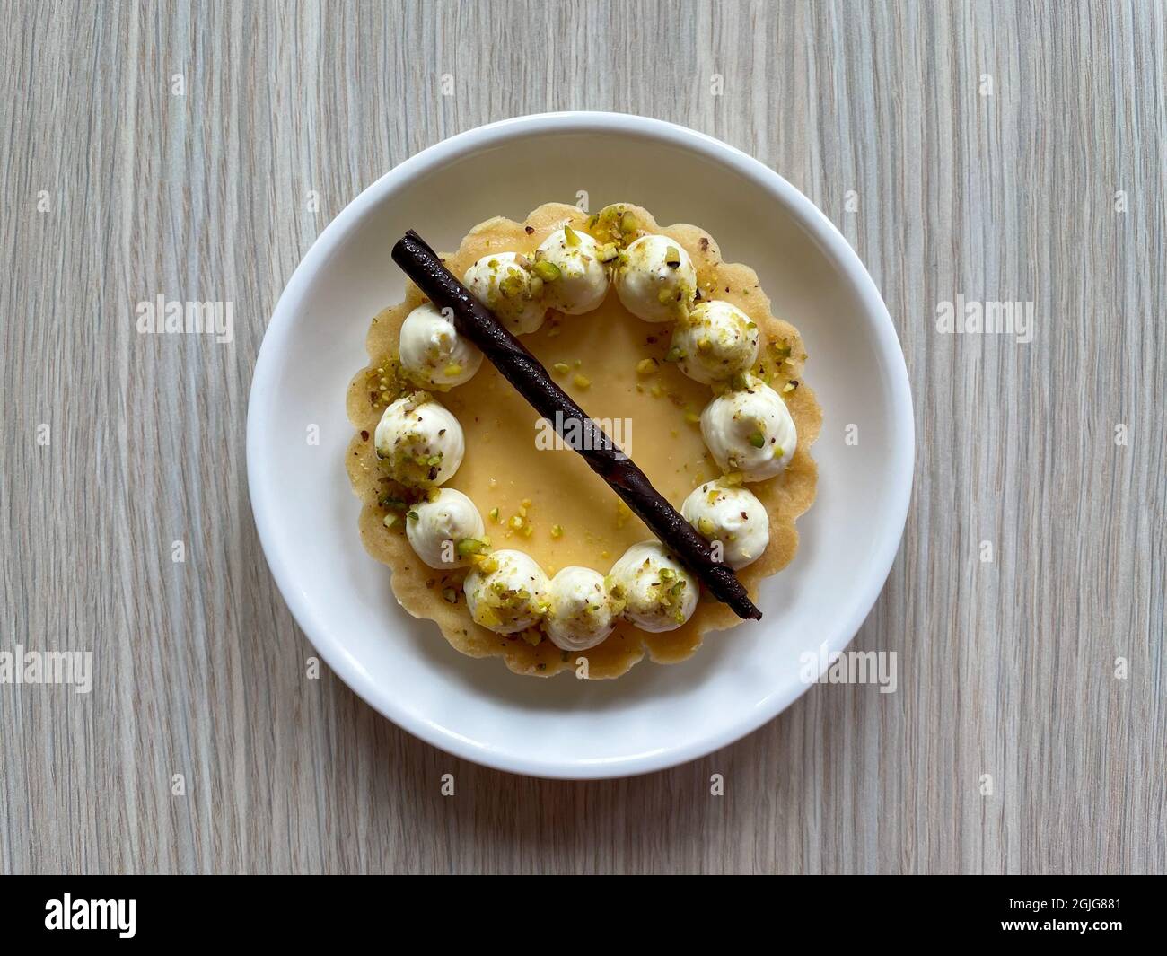 Closeup of a tartlet with passion fruit cream Stock Photo - Alamy