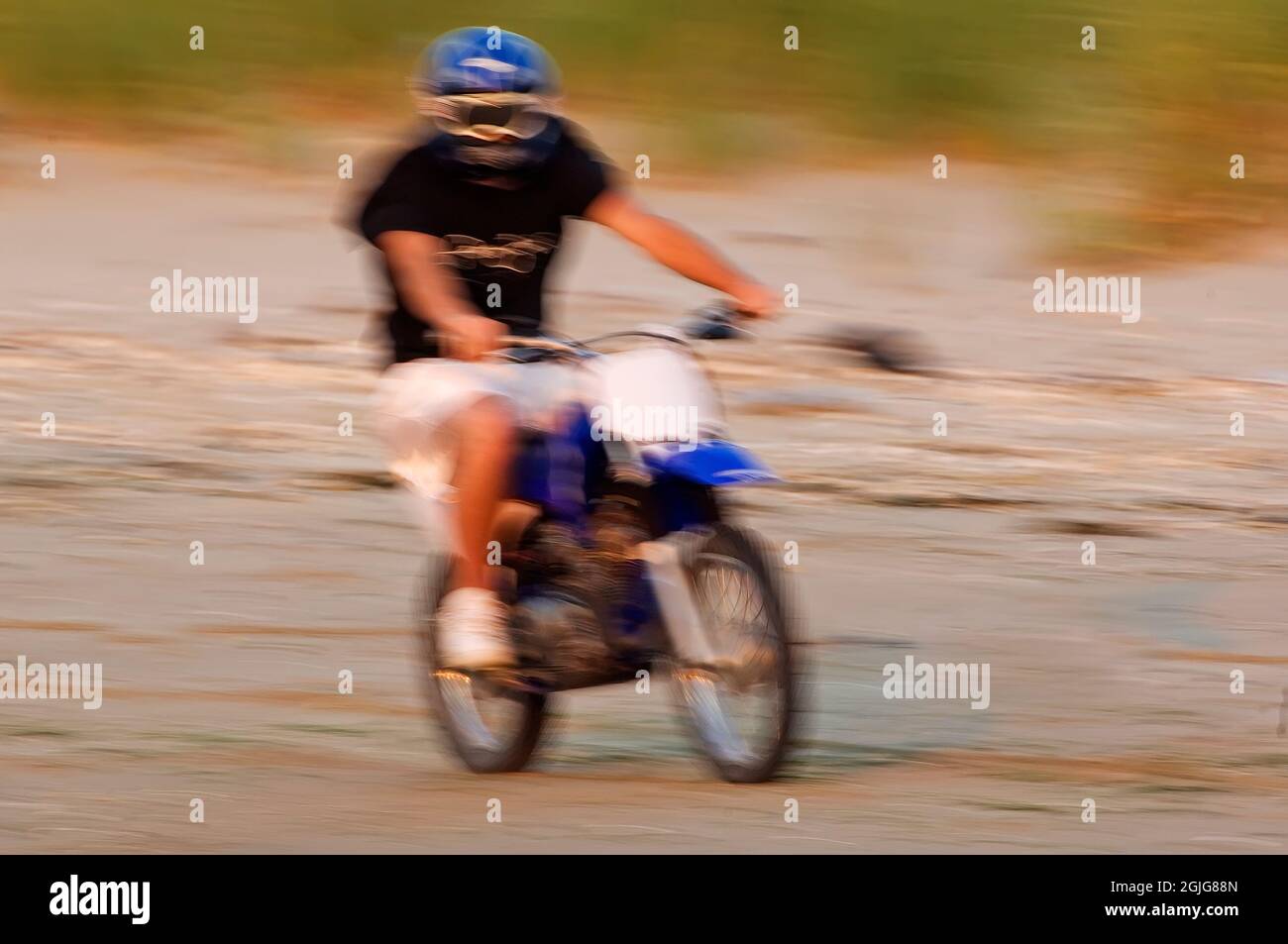 Teenager riding motorized bike at Breezy Point Gateway NRA beach during ...