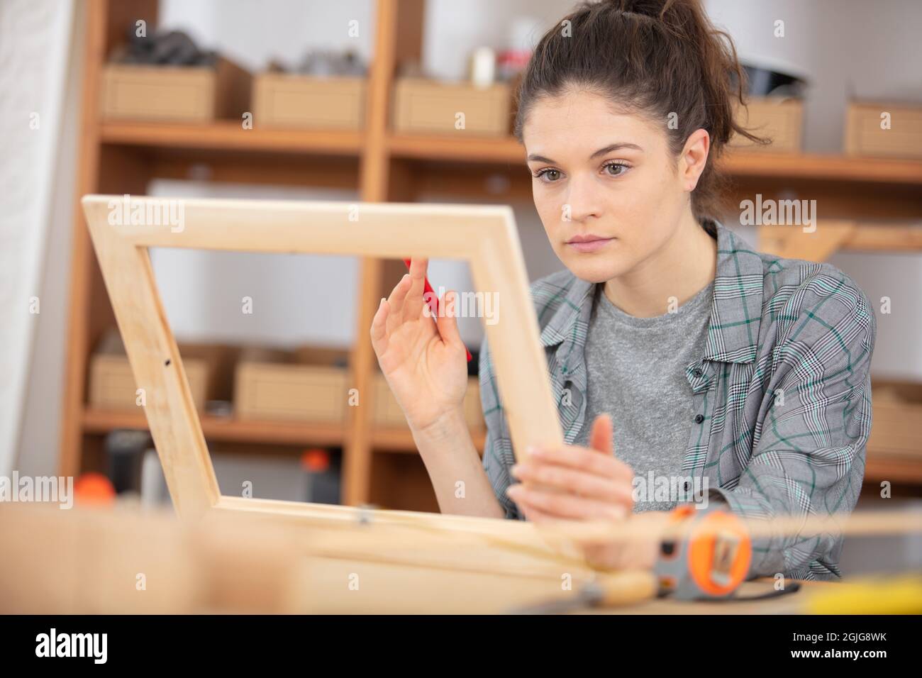 portrait of professional woodworker making marks on wooden piece Stock ...
