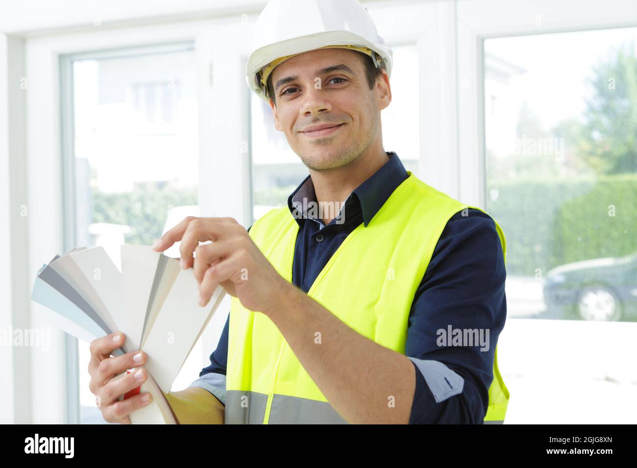 worker holding color shade swatches Stock Photo - Alamy