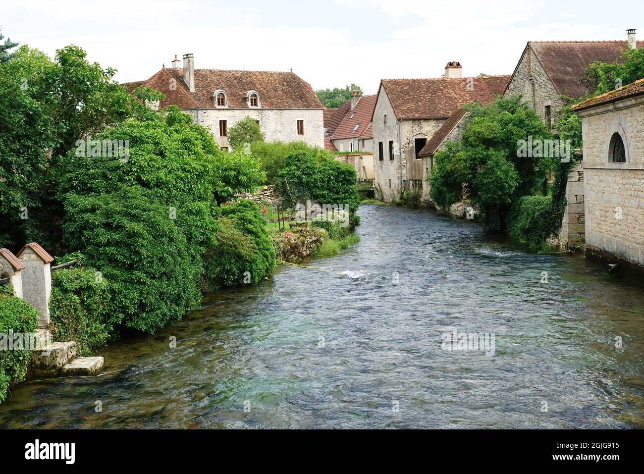 View of the river in the small ancient village of Beze in Cote D'or ...