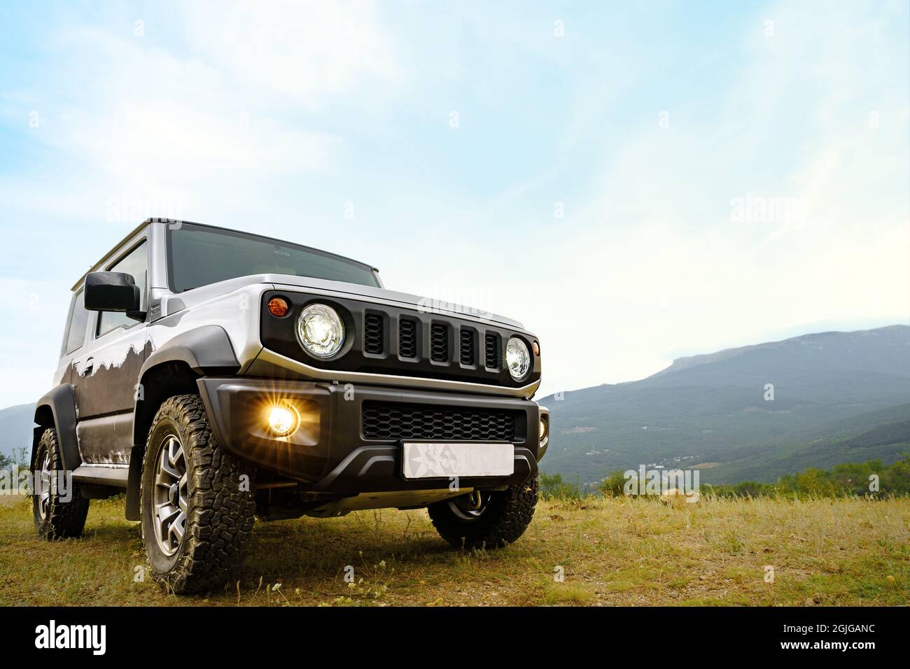 Dark gray off-road car in the mountains Stock Photo - Alamy