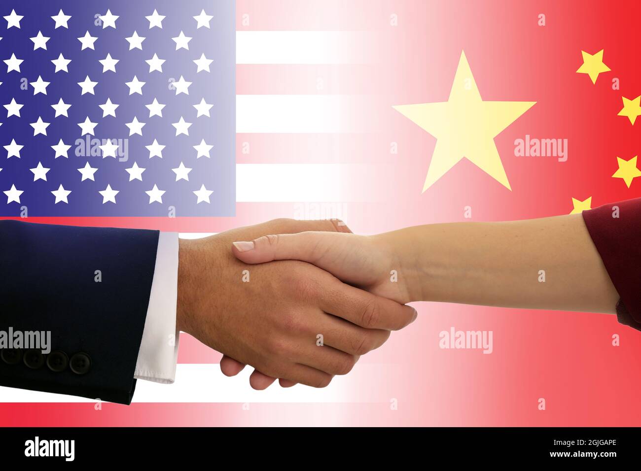 People shaking hands against USA and Chinese flags Stock Photo - Alamy