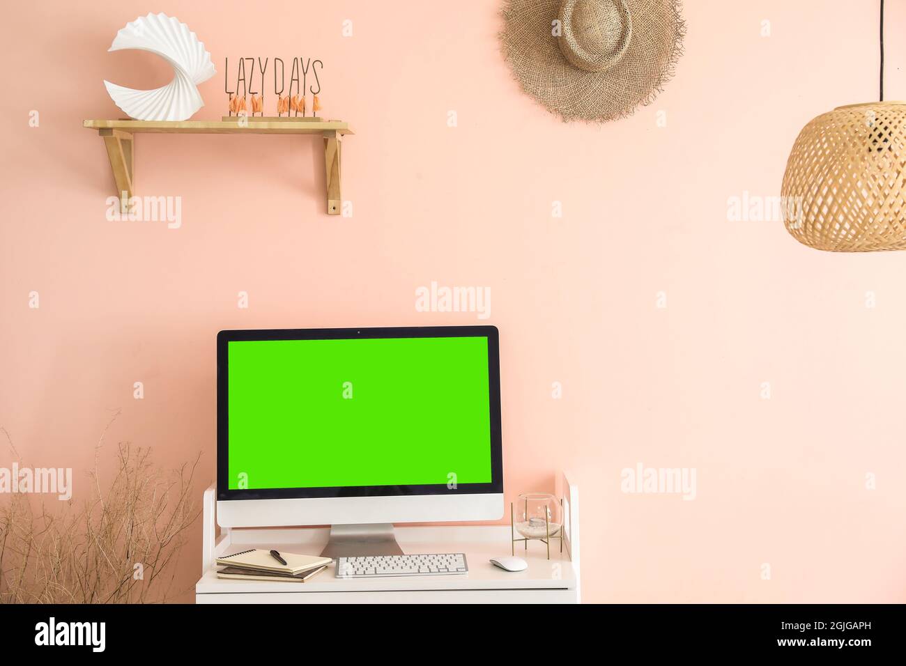 Modern computer with blank screen at workplace in interior of room ...