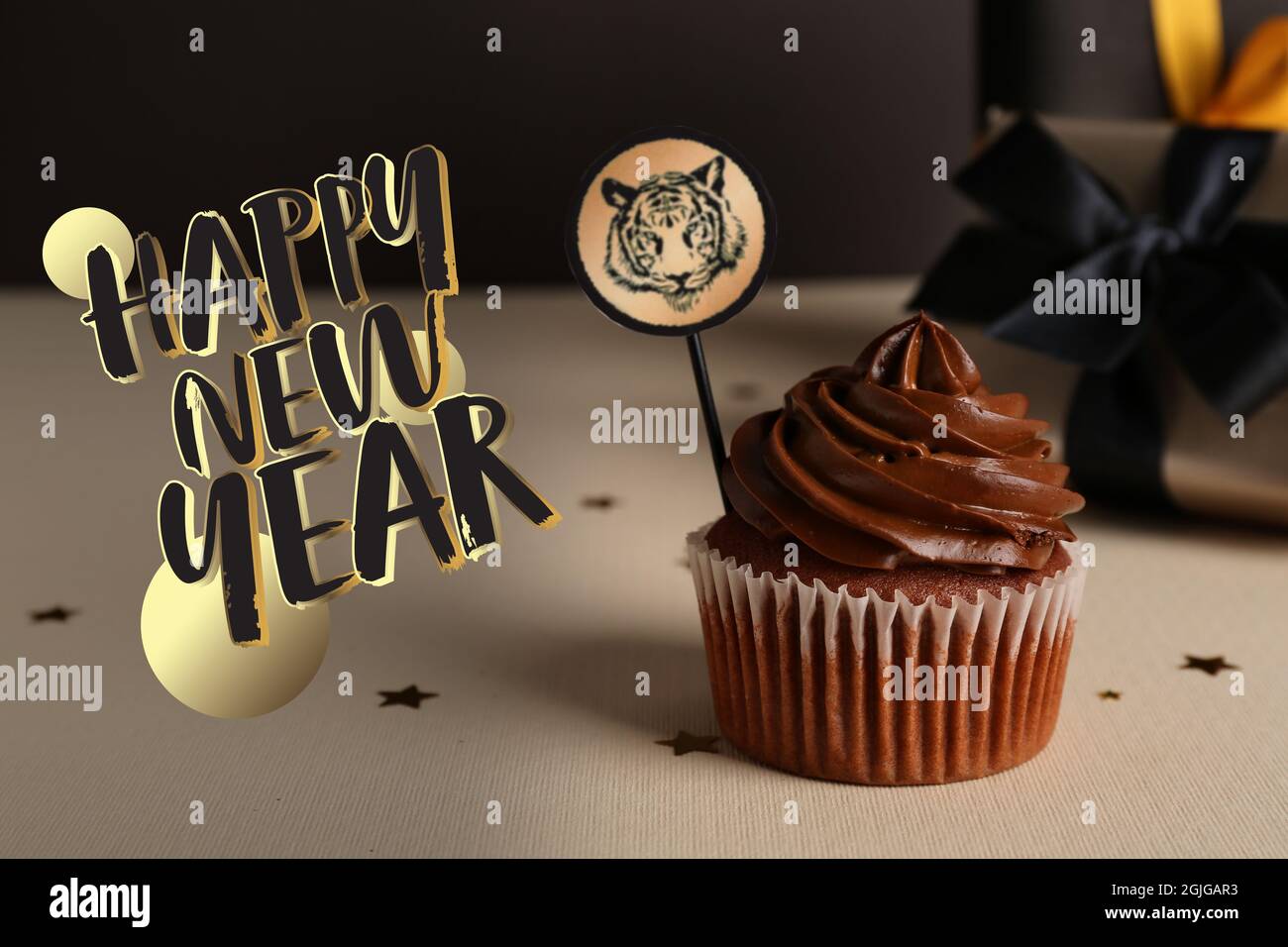 Tasty cupcake for New Year 2022 celebration on table Stock Photo - Alamy