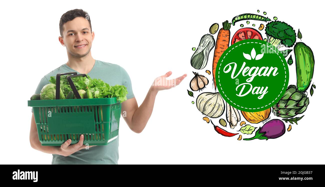 Greeting card for World Vegan Day with man holding fresh vegetables ...