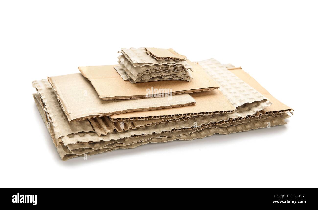 Pieces of cardboard on white background Stock Photo - Alamy