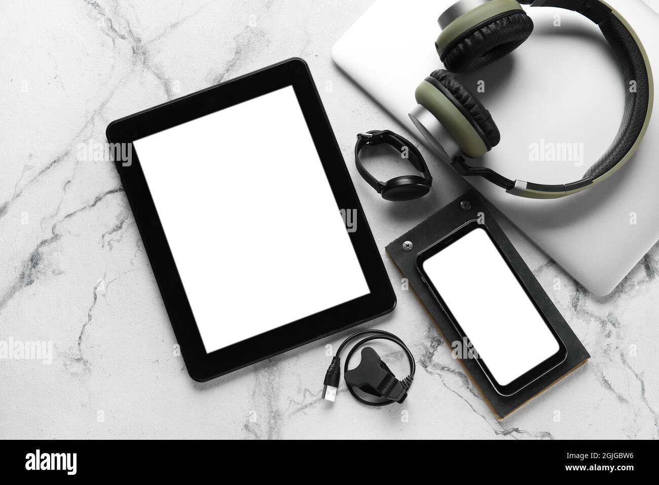 Different modern devices and notebook on light background Stock Photo ...
