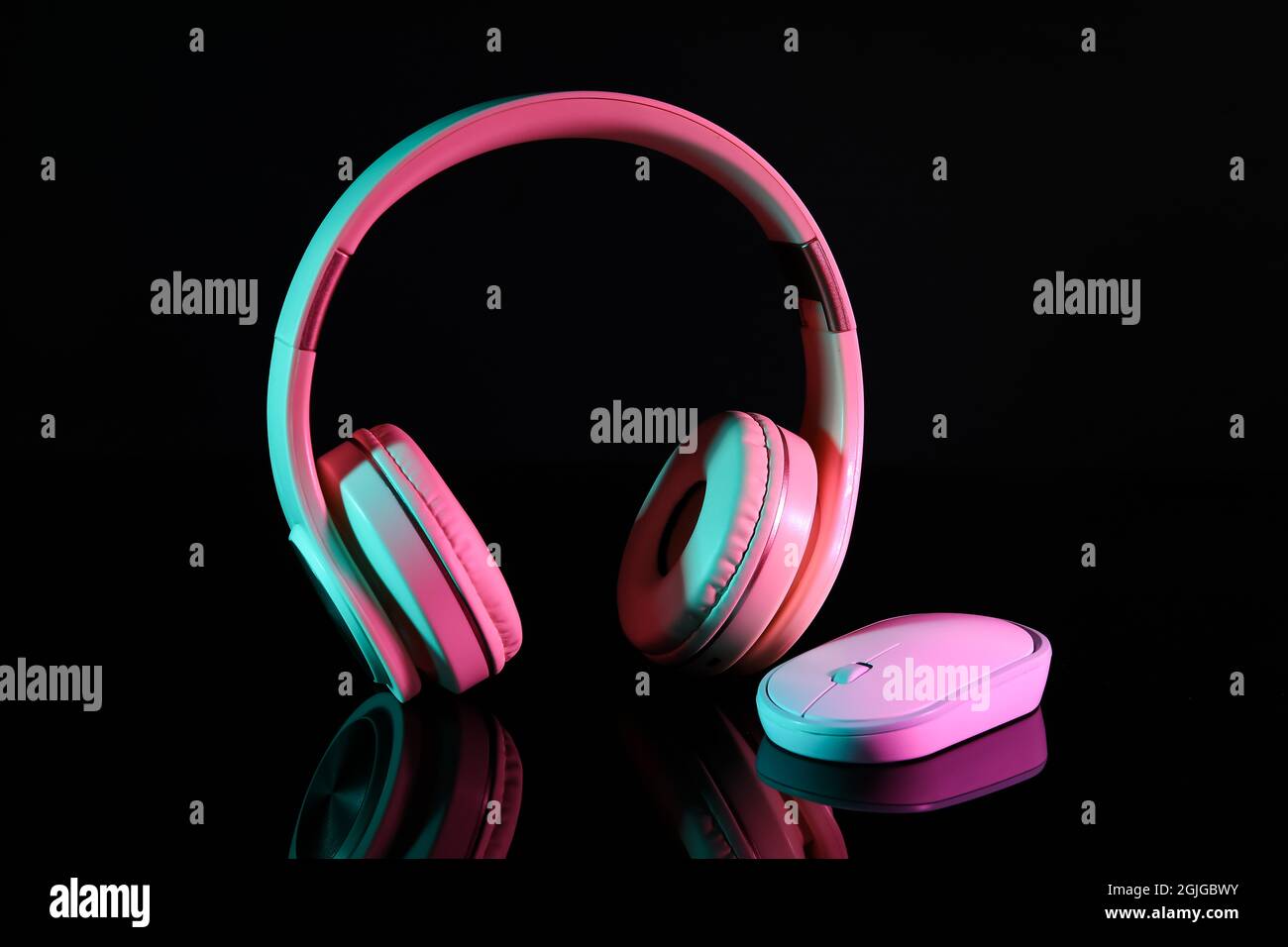 Modern computer mouse and headphones on dark background Stock Photo - Alamy