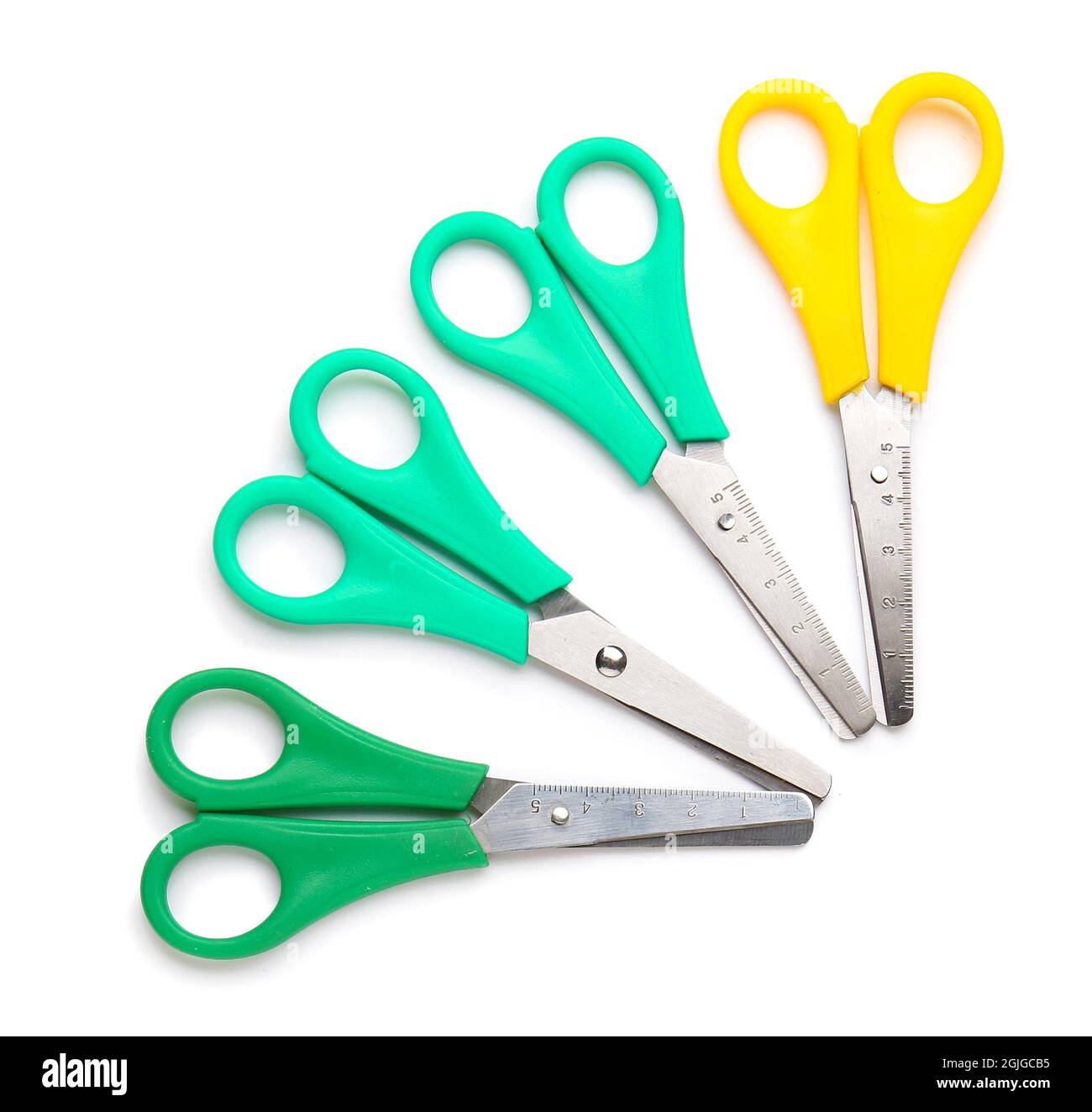 Yellow scissors among green ones on white background. Concept of ...