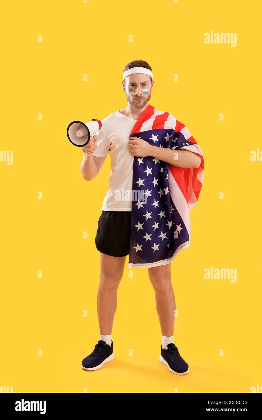 Sport fan with USA flag and megaphone on color background Stock Photo ...