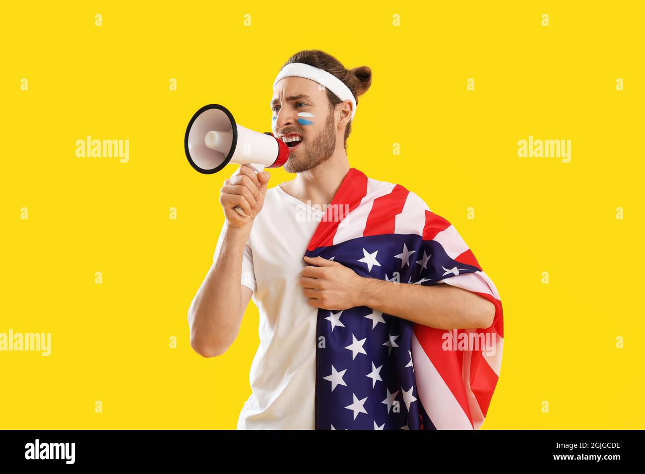 Sport fan with USA flag and megaphone on color background Stock Photo ...