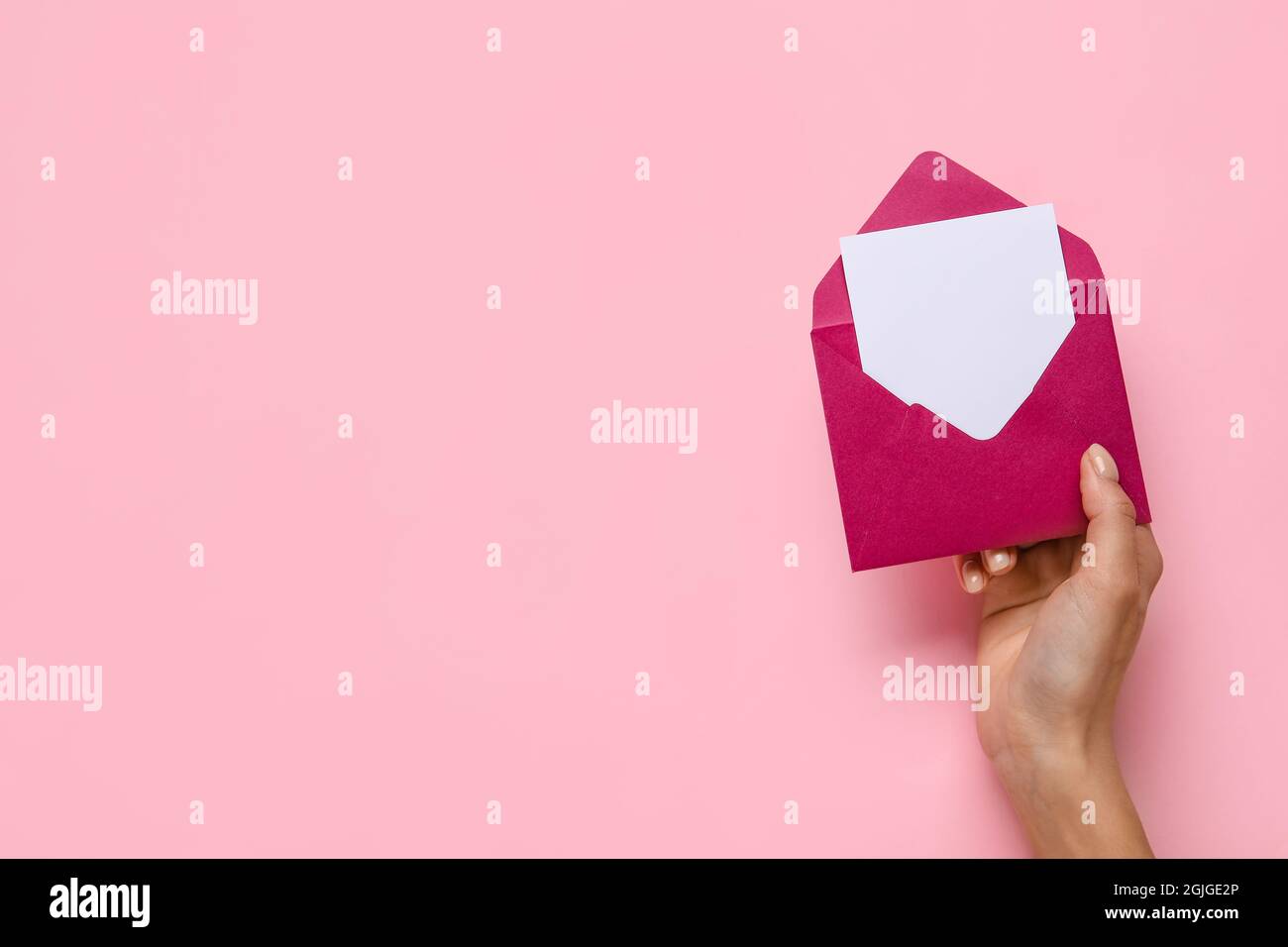 Female hand with envelope and blank card on color background Stock ...