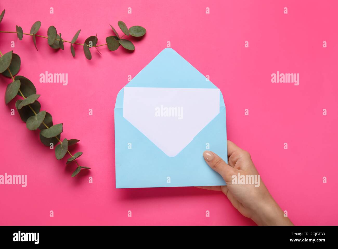 Female hand with envelope and blank card on color background Stock ...