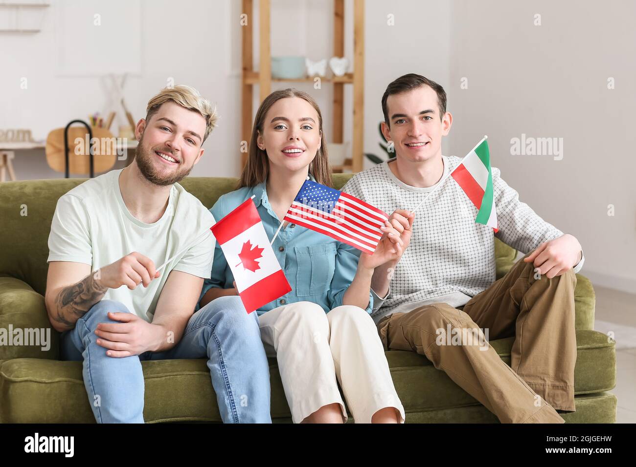 Young people with different flags at home Stock Photo - Alamy