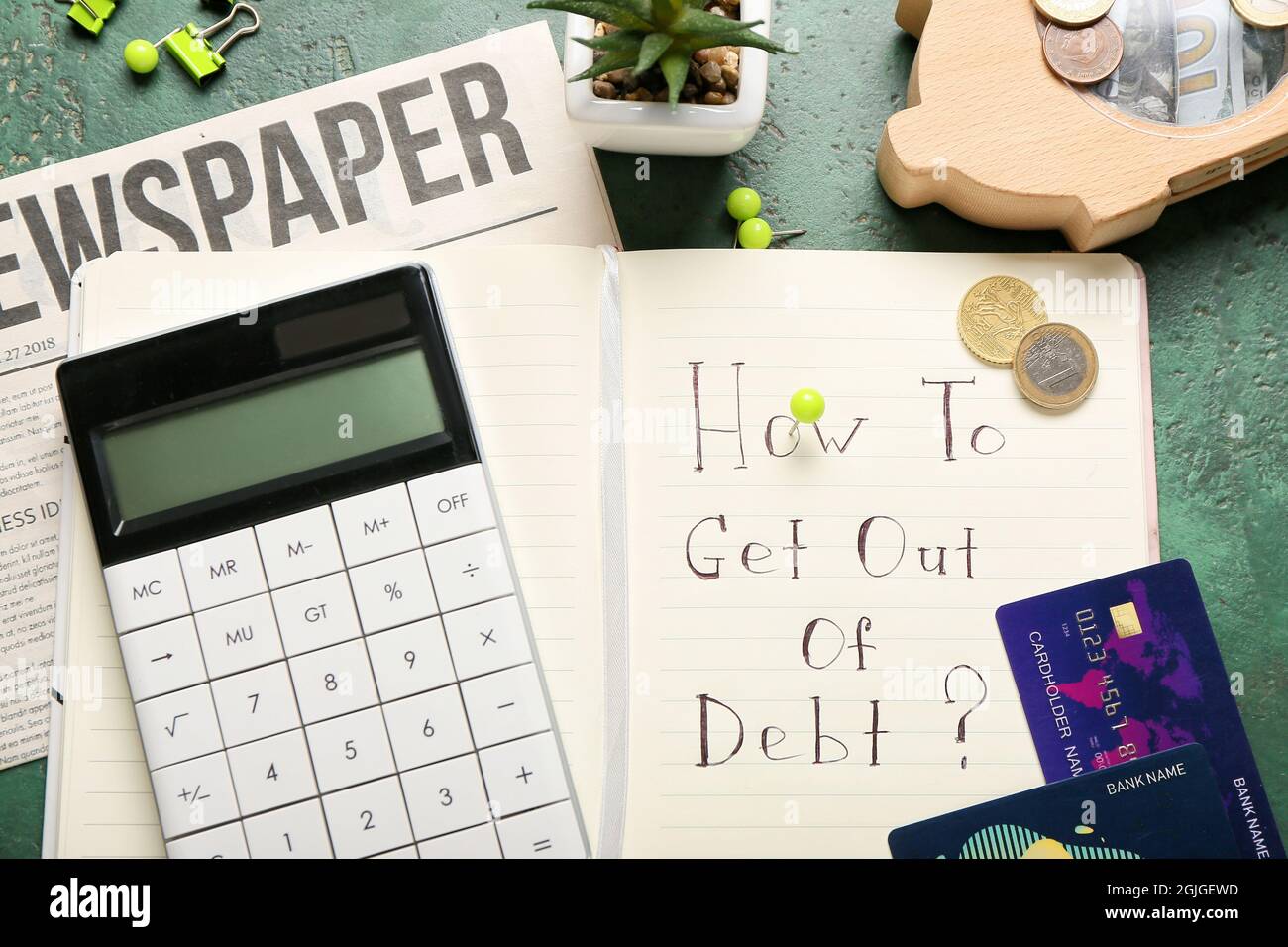 Notebook, calculator and money on color background Stock Photo - Alamy