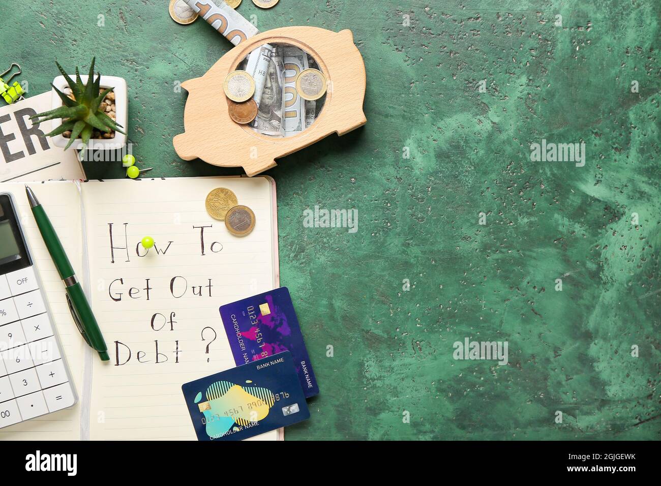 Notebook, piggy bank and money on color background Stock Photo - Alamy