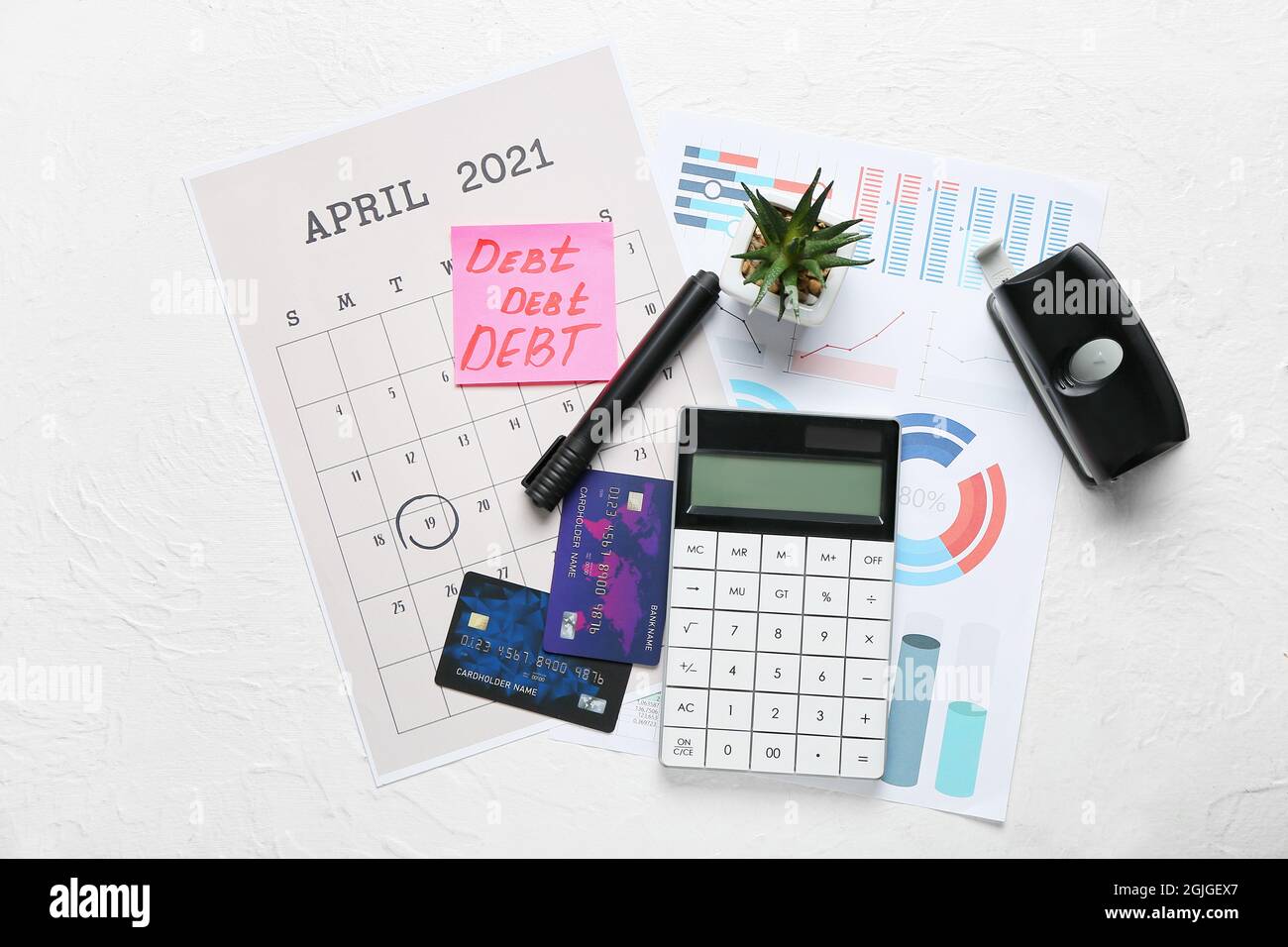 Calendar with credit cards and stationery on white background Stock ...