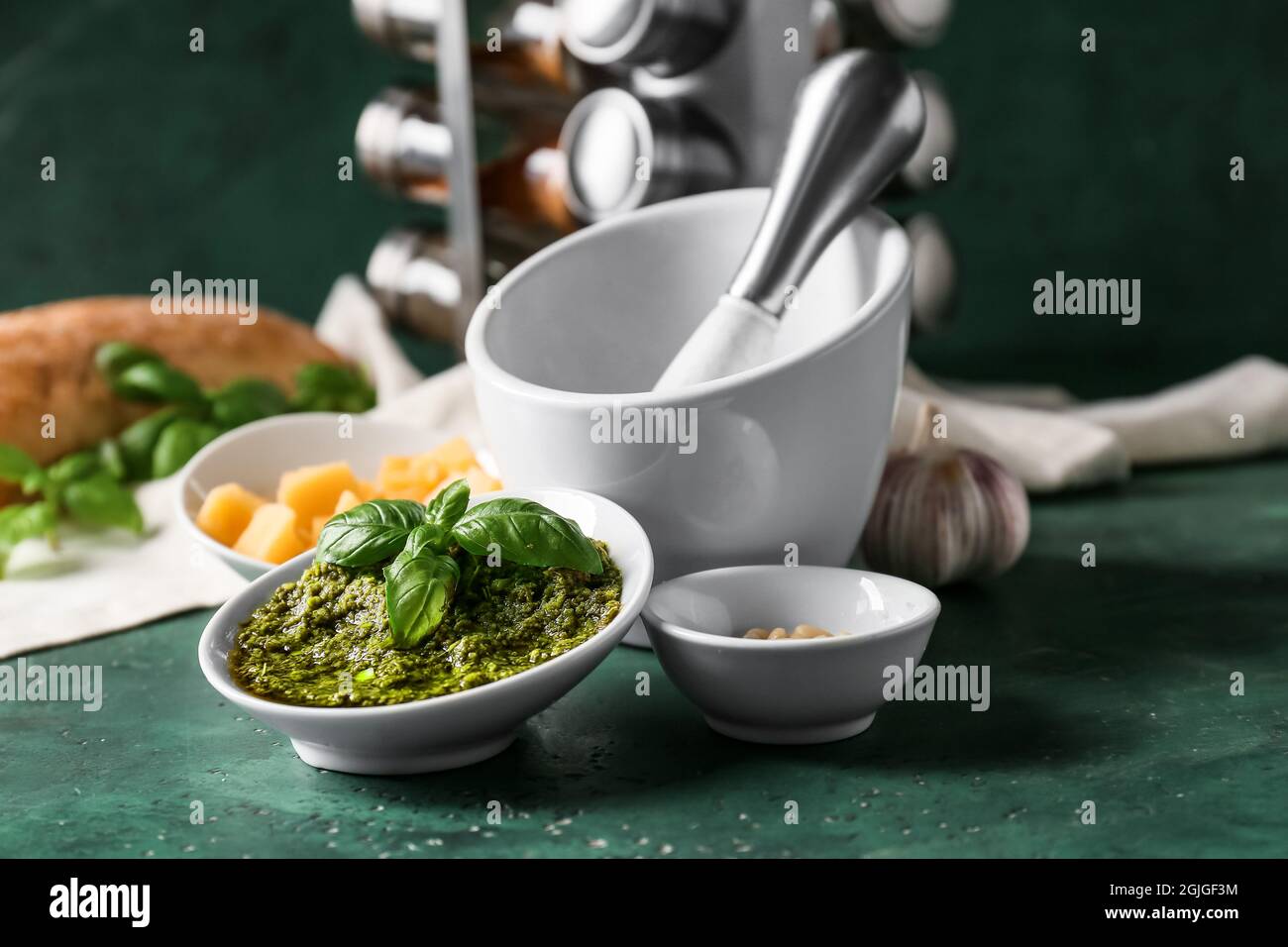 Mortar with tasty pesto sauce on table, closeup Stock Photo - Alamy