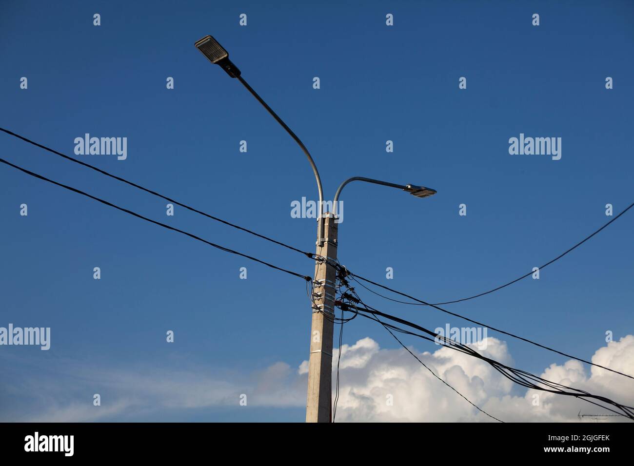Fan pole with wires. Electric wires in the sky. Power grids on the pole ...
