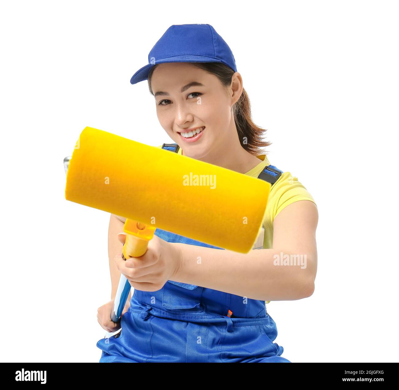 Female painter with roller brush on white background Stock Photo - Alamy