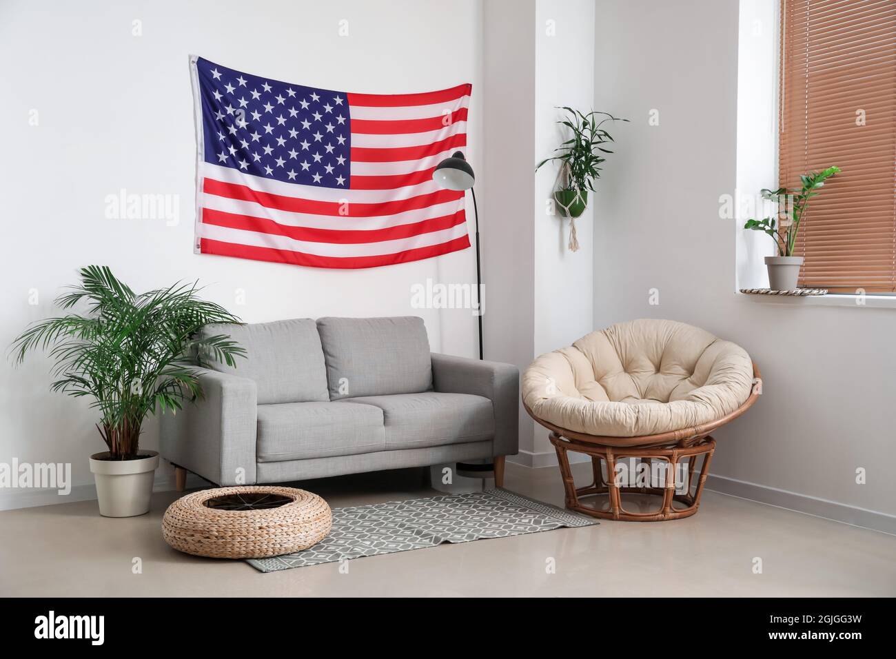 Interior of stylish living room with USA flag Stock Photo - Alamy
