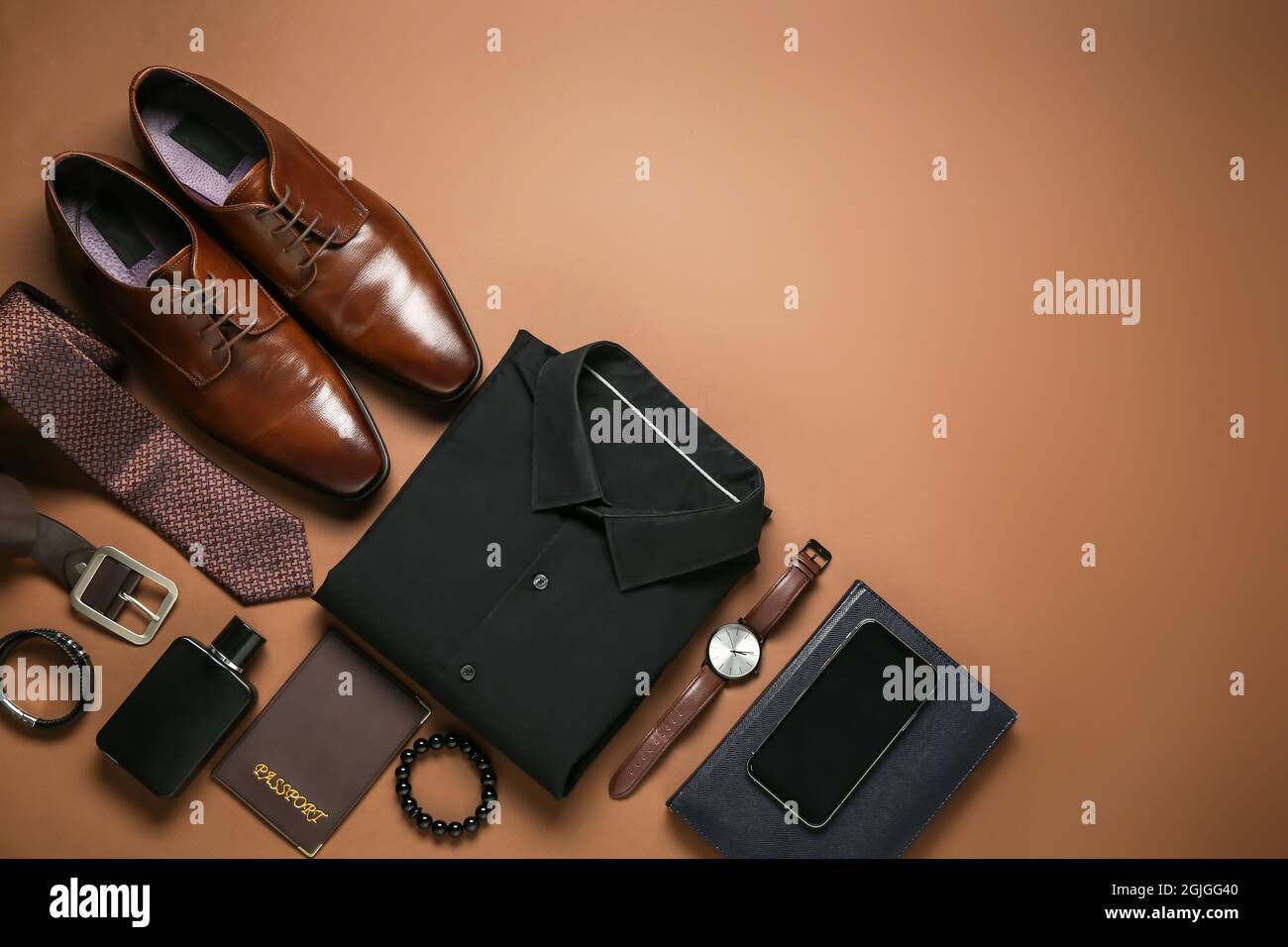 Stylish male clothes, mobile phone and accessories on color background ...