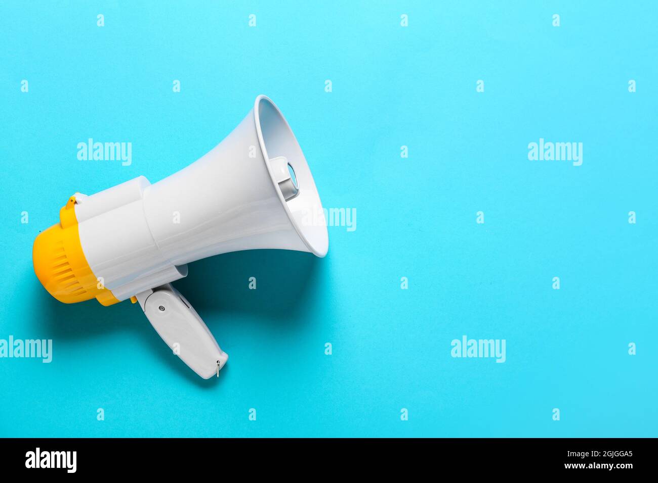 Modern megaphone on color background Stock Photo - Alamy
