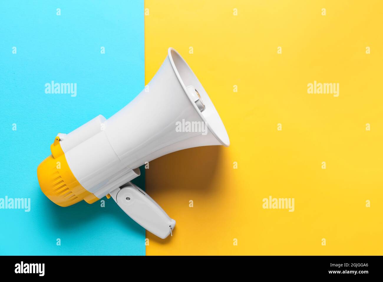 Modern megaphone on color background Stock Photo - Alamy