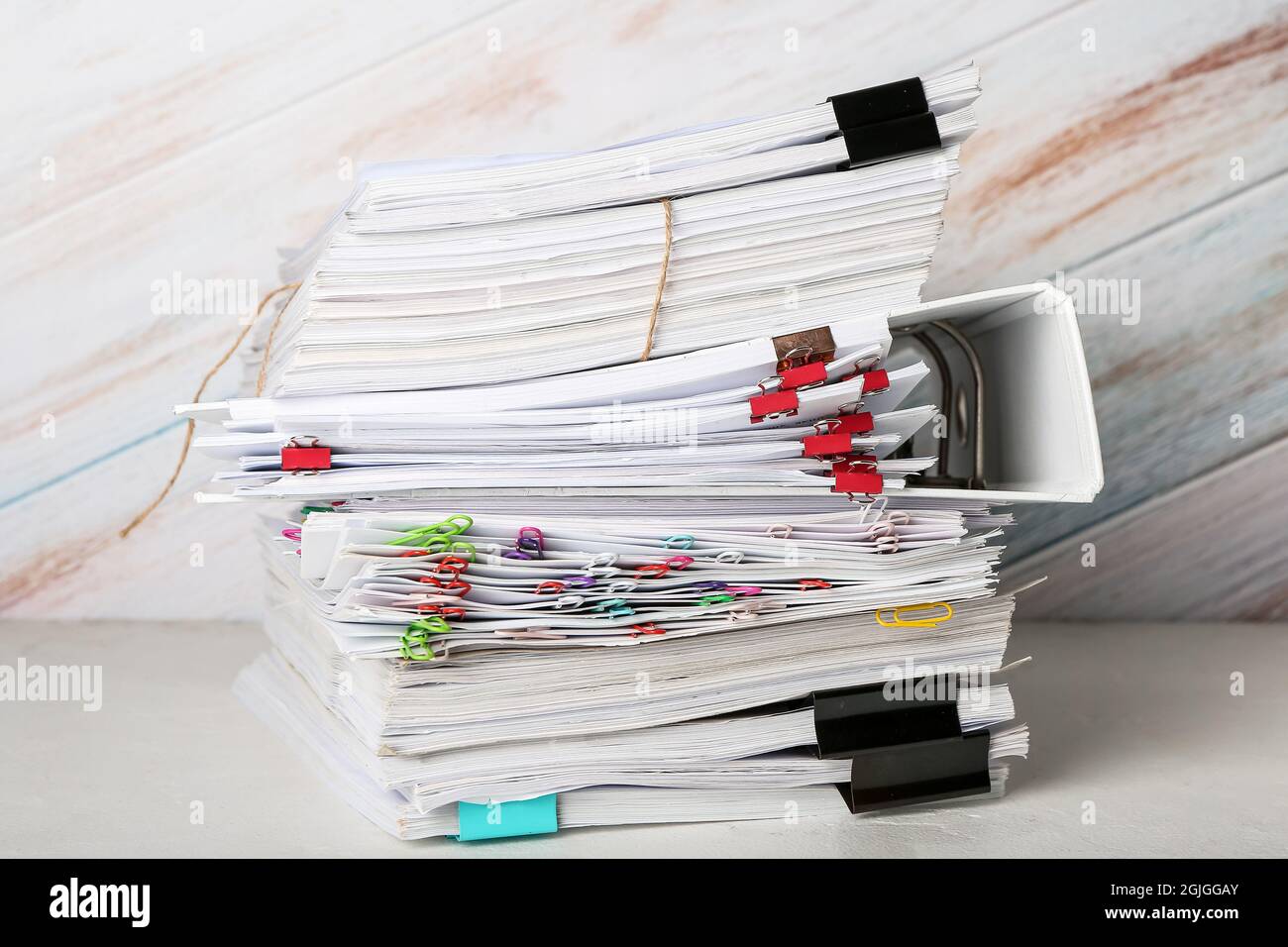 Stack of documents on light background Stock Photo - Alamy