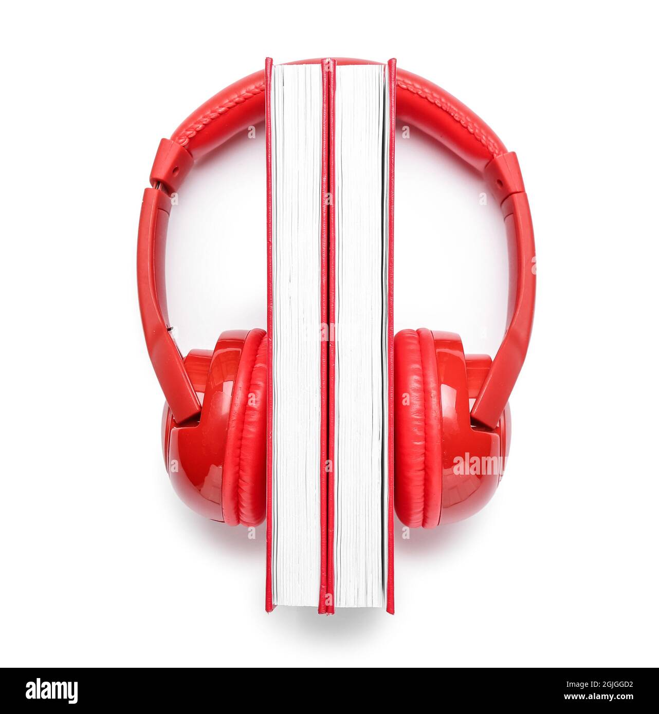 Modern headphones with books on white background Stock Photo - Alamy