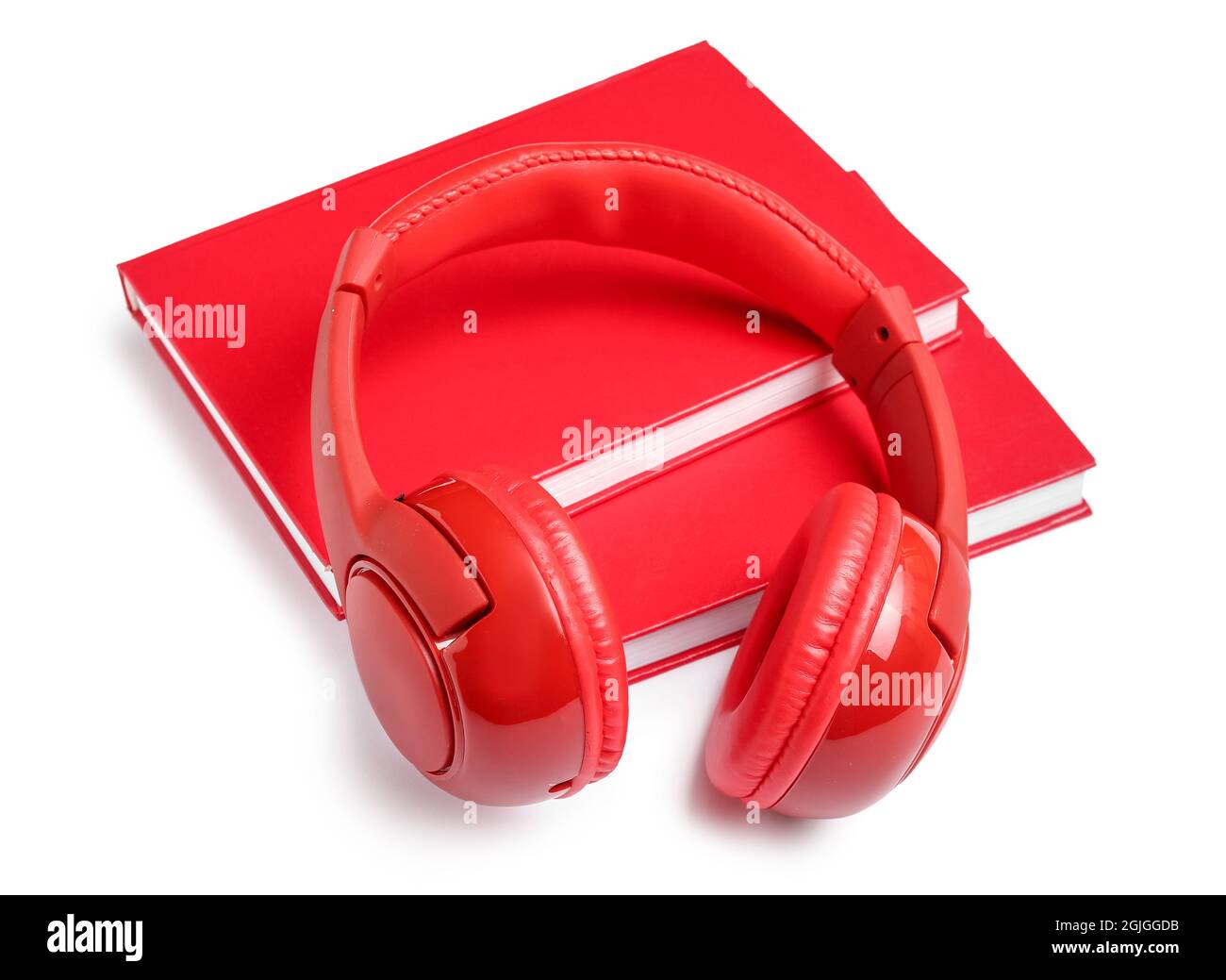 Modern headphones with books on white background Stock Photo - Alamy