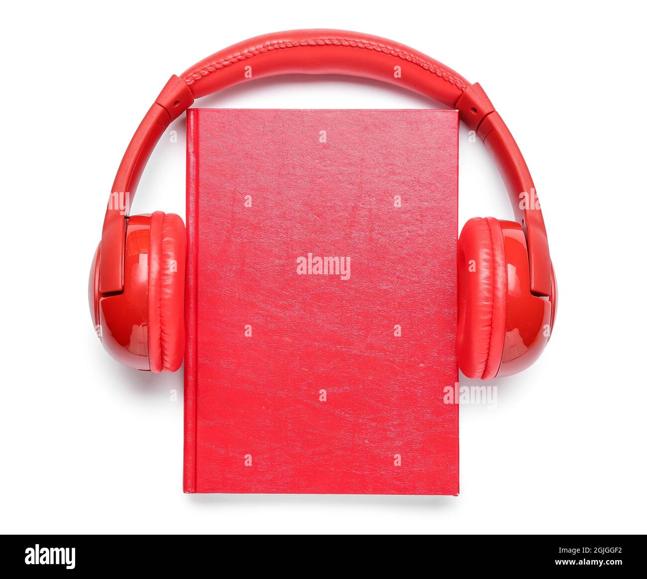 Modern headphones with book on white background Stock Photo - Alamy