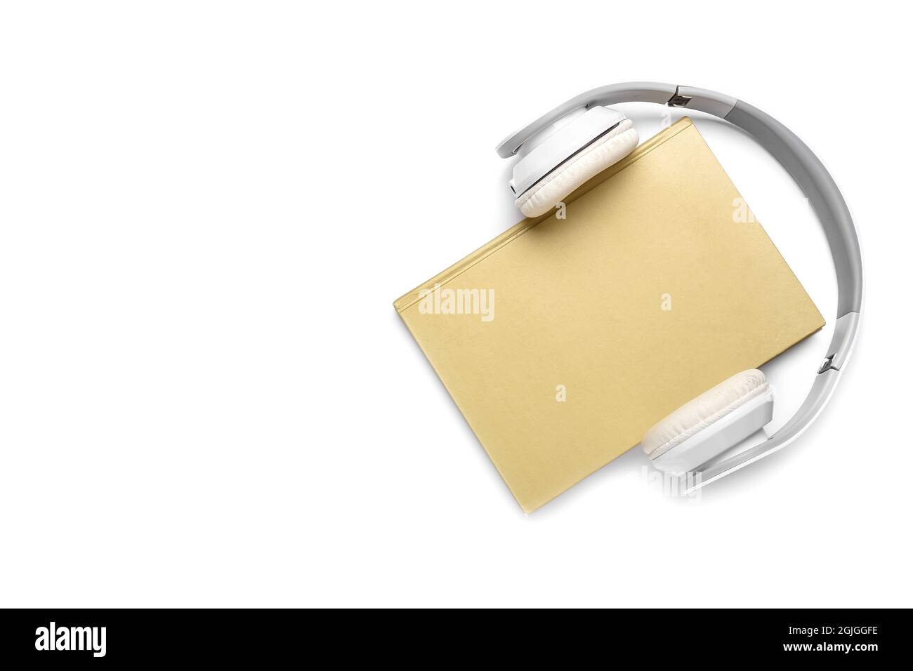 Modern headphones with book on white background Stock Photo - Alamy