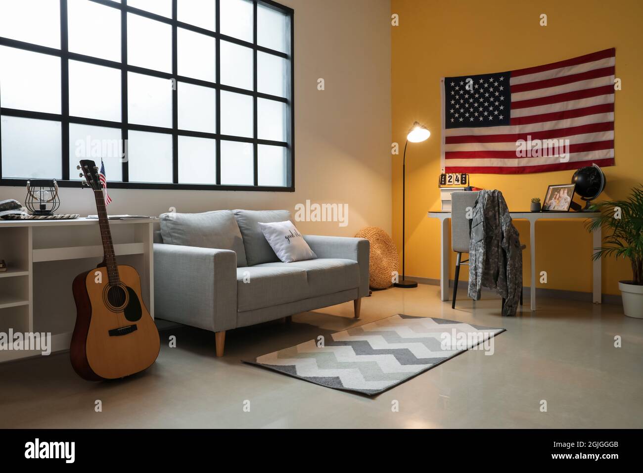 Interior of stylish living room with USA flag Stock Photo - Alamy