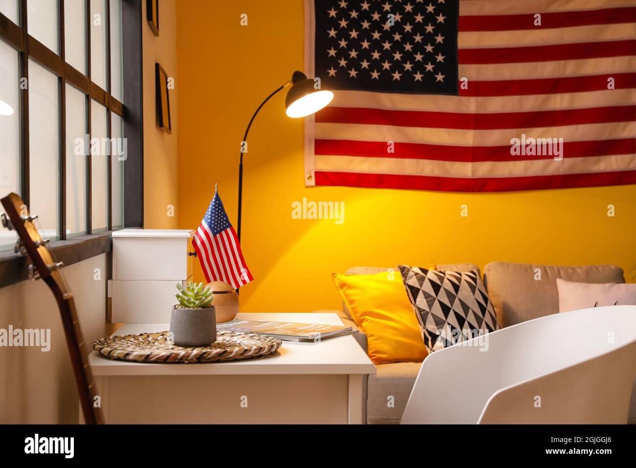 Modern workplace with USA flag in room Stock Photo - Alamy