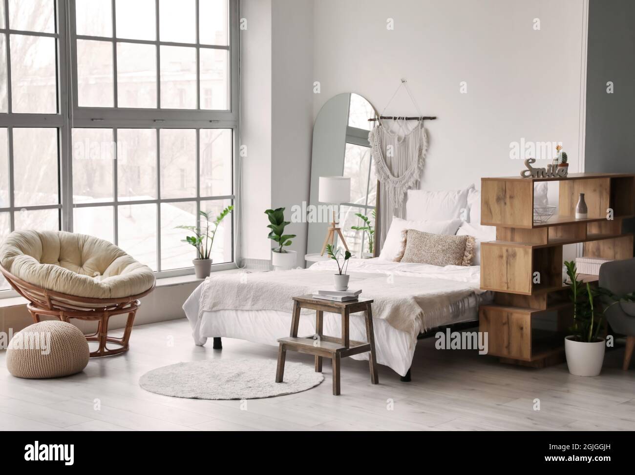 Interior of stylish room with comfortable bed Stock Photo - Alamy