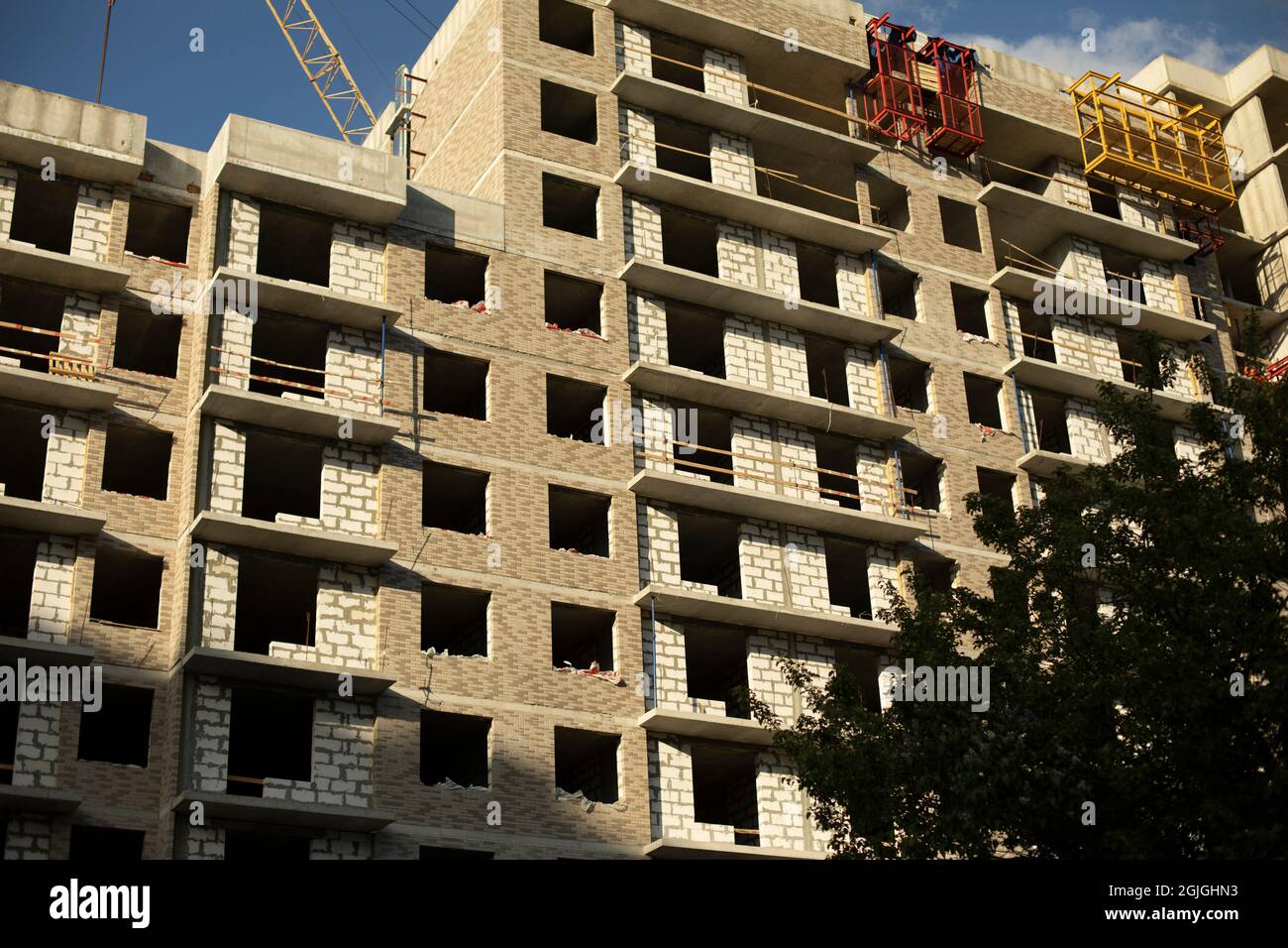 Construction of a building in the city. Unfinished house with empty ...