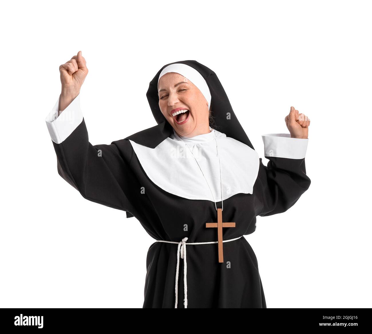 Happy mature nun dancing on white background Stock Photo - Alamy