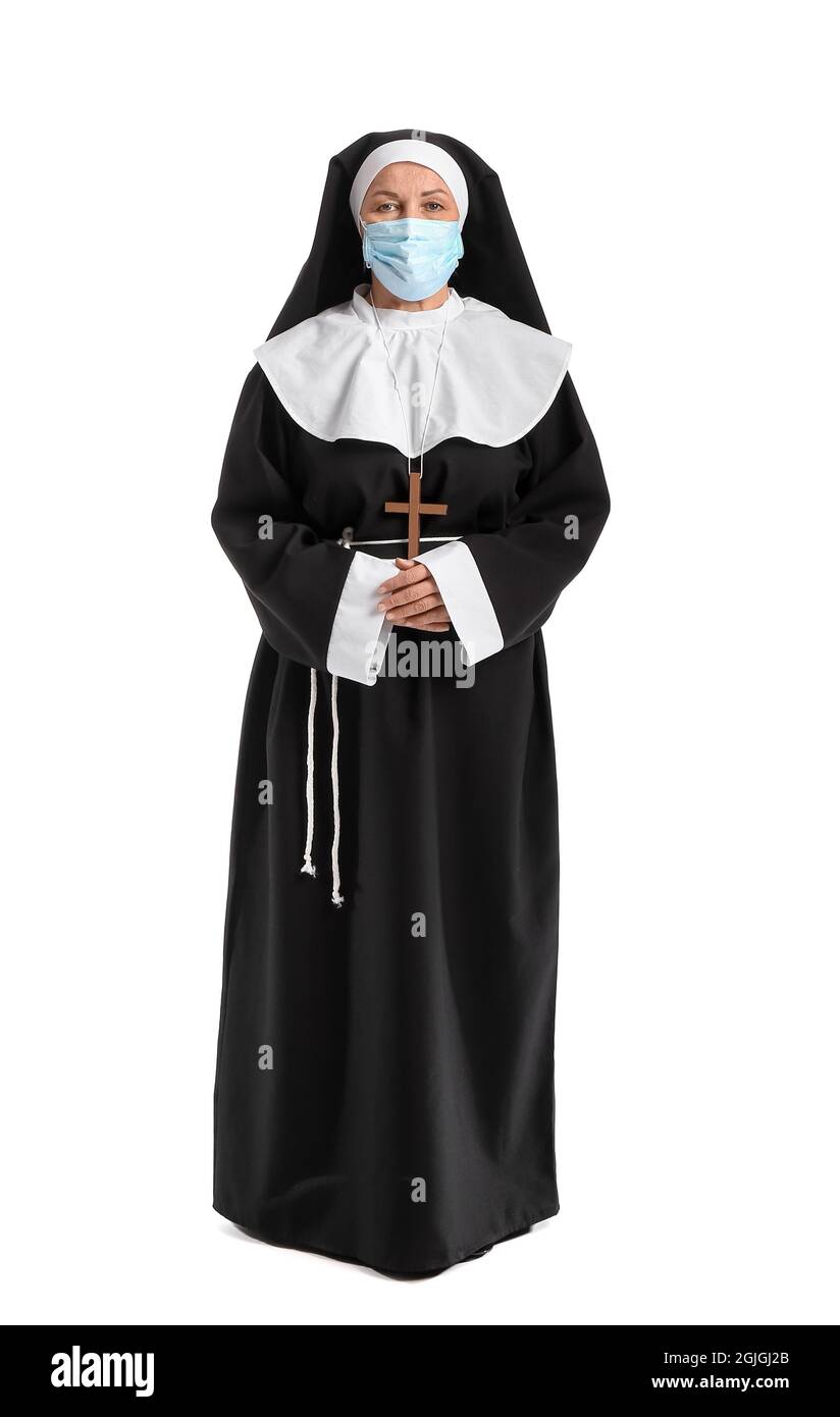 Mature nun in medical mask on white background Stock Photo - Alamy