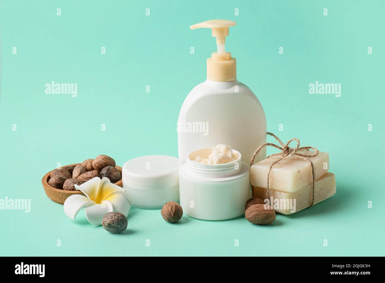 Composition with shea butter, nuts and bath supplies on color ...