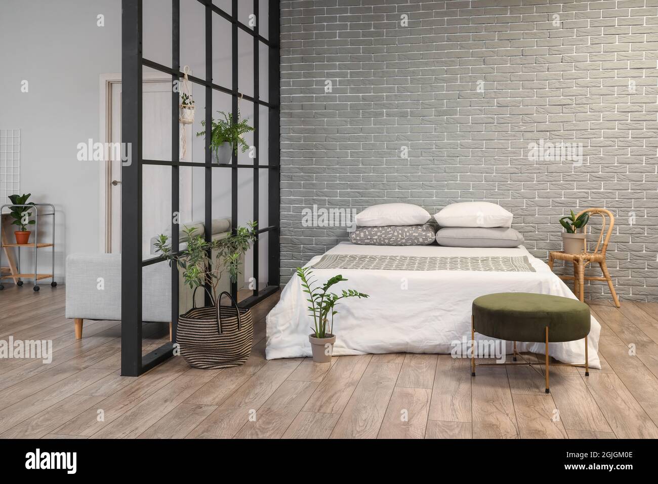 Interior of stylish bedroom with folding screen Stock Photo - Alamy